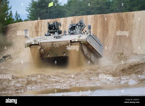 An Ajax Ares Tank An Armoured Personnel Carrier On The Training Range