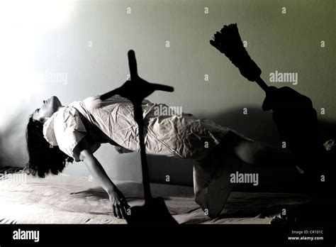 Exorcism Of Exorcist Levitation And Woman Possessed By The Devil Stock