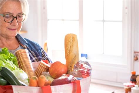 Premium Photo Woman Looking At Objects In Bag