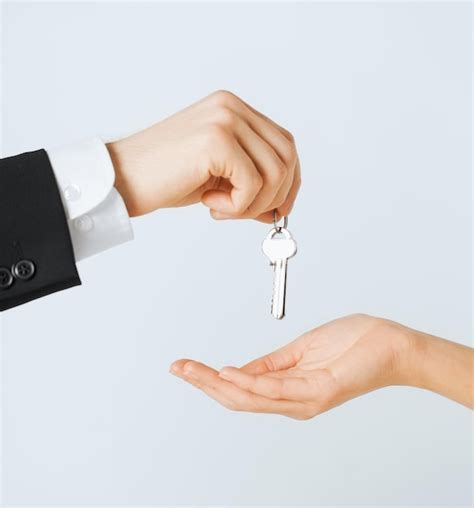 Premium Photo Picture Of Man Hand Passing House Keys To Woman