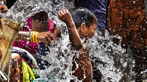 In Photos Glimpses Of People Braving Scorching Summer Heat In