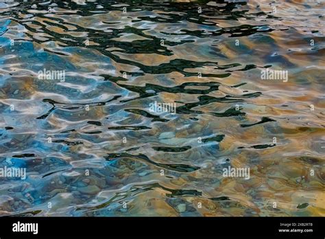 Abstract Aquatic Patterns Created By The Reflected Light On The