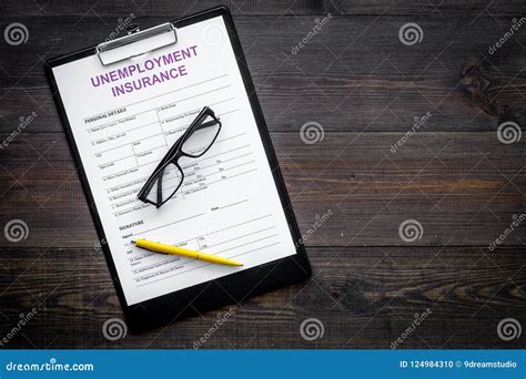 Unemployment Insurance Form On Dark Wooden Background Top View Copy