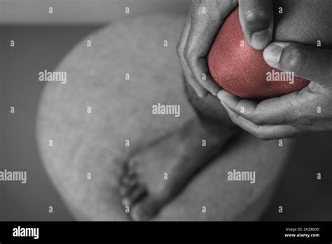 The Man Holds His Pain Point Of Knee Joint The Red Point Shows