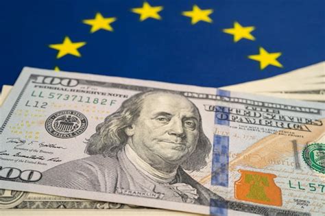 Premium Photo Us Dollar Banknotes On Eu Flag Background Business And