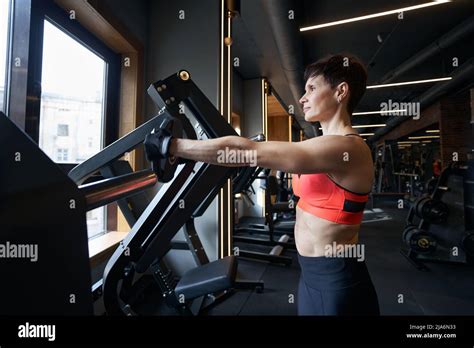 Professional Female Athlete Doing Upper Body Strength Exercise Stock