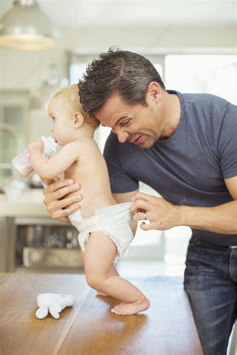 Father Checking Baby S Diaper Stock Image F014 3244 Science Photo