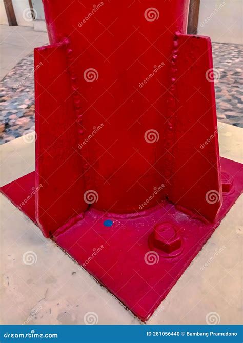 Closeup Surface Detail Of Red Metal Plate Support Is Bolted To The