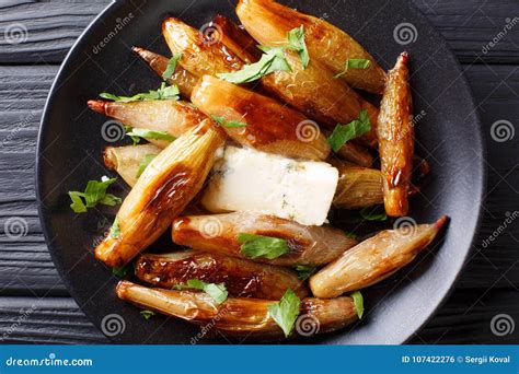 Whole Caramelized Balsamic Shallots With Blue Cheese And Parsley Stock