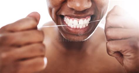 Always Remember To Floss Regularly An Unrecognizable Young Man