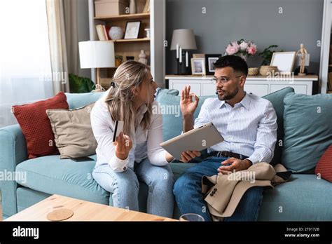 Husband And Wife Business People Arguing About Spending Money Online