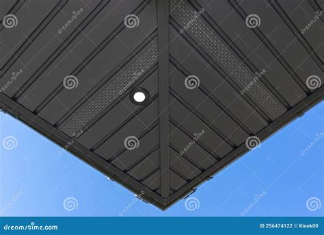 A Modern Graphite Herringbone Roof Lining Is Attached To The Trusses