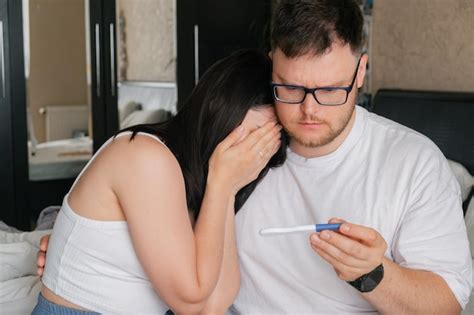Premium Photo Worried Couple Looking At Positive Pregnancy Test Unwanted