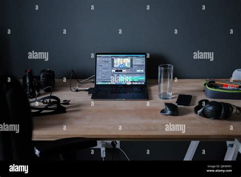 A Working Desk With A Laptop Doing Content Creation In Germany Stock