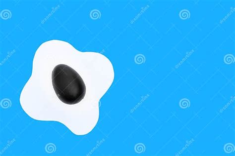 Creative Layout Made Of Scrambled Eggs With Painted Black Half Easter