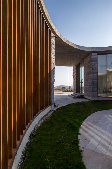 Elliptical Cheese Factory Wraps Glazed Viewing Courtyard
