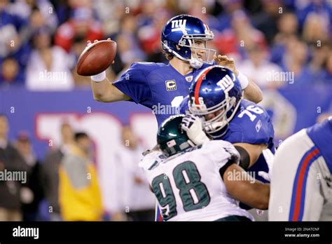 New York Giants Quarterback Eli Manning Throws Against The Philadelphia