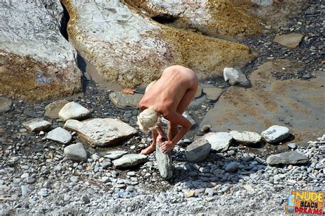 Naked Milf Playing With Her Man On The Beach 14 Photos