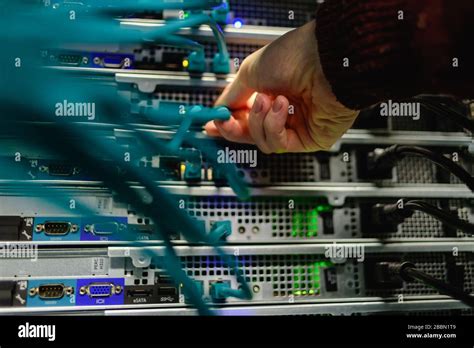 Man Data Center Technician Performing Server Maintenance Replacing