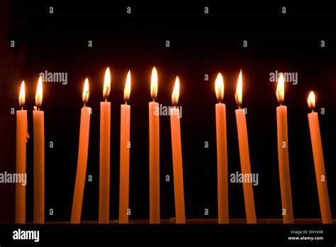 eleven burning candles Stock Photo - Alamy