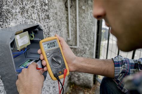 Electrician Using Voltmeter Stock Photo Image Of Measurement Measuring