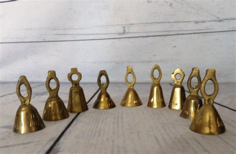 Brass Bell Set Of Nine Small Solid Brass Bells Miniature Etsy Brass Bells Bells Etched Designs