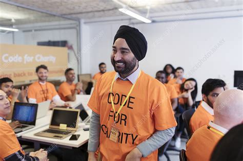 happy hacker in turban coding at hackathon stock image f022 3013