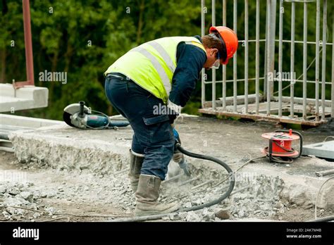 Worker With Jackhammer To Break Up Concrete Stock Photo Alamy