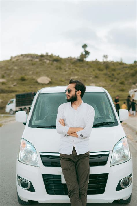 Man In White Crew Neck T Shirt Wearing Black Leather Strap Watch · Free