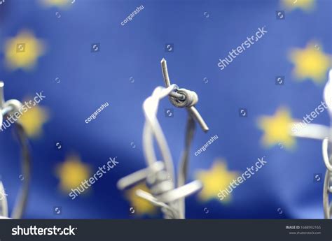 European Union Flag Barbed Wire Migration Stock Photo 1688992165