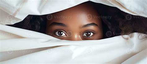 African Girl Hiding Face Under Blanket While Lying In Bed 27186541