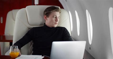 Premium Photo Portrait Of Tired Young Businessman Flying First Class