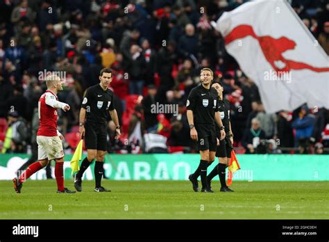 Jack Wilshere Of Arsenal Argues With Referee Craig Pawson During The