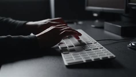 TOP VIEW Adult Man Typing On A Laptop Keyboard In A Dark Room Stock Footage Video 6896581