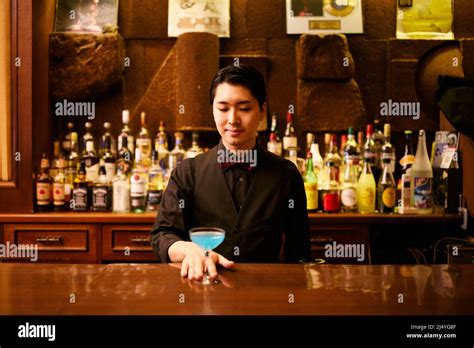 Japanese Bartender Serving A Drink Stock Photo Alamy