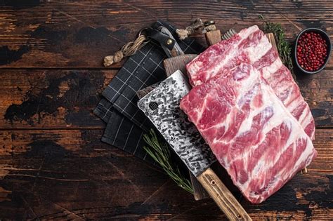 Premium Photo Butcher Board With Rack Of Raw Pork Spare Ribs Wooden