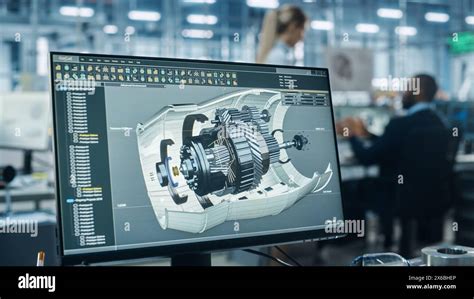 Car Factory Office Engineer Working On Turbine Prototype On Computer