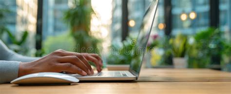 The Comfortable Workspace Featuring A Laptop Surrounded By Lush Greenery And Soft Lightai