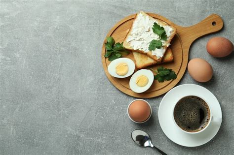 Premium Photo Concept Of Tasty Breakfast With Boiled Eggs On Gray