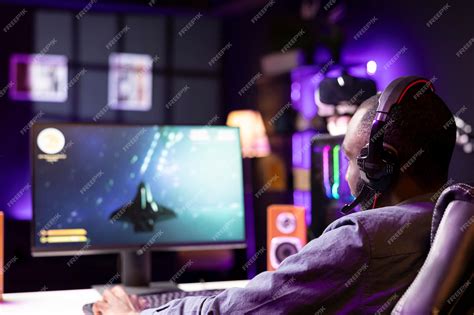 Free Photo Gamer Navigating Universe In Game Chatting With Friends