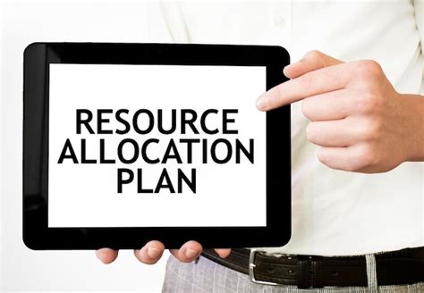 Premium Photo Text Resource Allocation Plan On Tablet Display In Businessman Hands On The