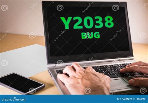 Man Hands Typing On A Laptop In Text Code Y2038 Problem Concept Stock Photo Image Of