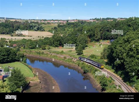 Northern Rail Class 156 Diesel Multiple Unit Train Passing By The River