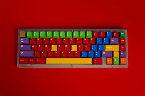 A Colorful Keyboard On A Red Background Photo Free Electronics Image