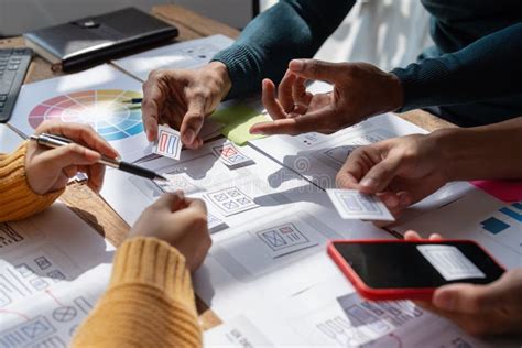 group of ux developer and ui designer brainstorming about app interface