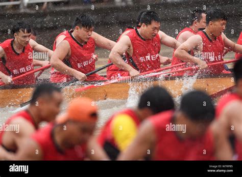 Participants Compete In A Dragon Boat Race Held To Celebrate The Dragon