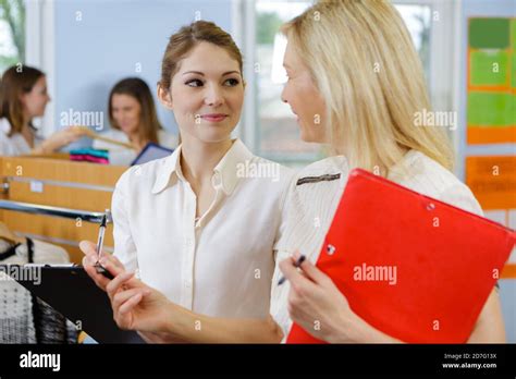 Two Female Workers In Warehouse Stock Photo Alamy