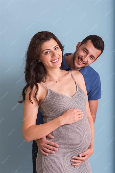 Premium Photo Portrait Of A Happy Young Couple Man Holding His