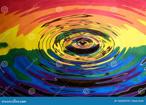 The Gay Pride Extinction Rebellion Flag And Logo Reflected In Circular