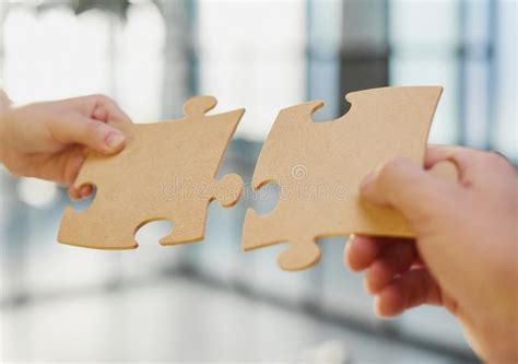 Close Up Of Business People Connecting Couple Puzzle Jigsaw Business